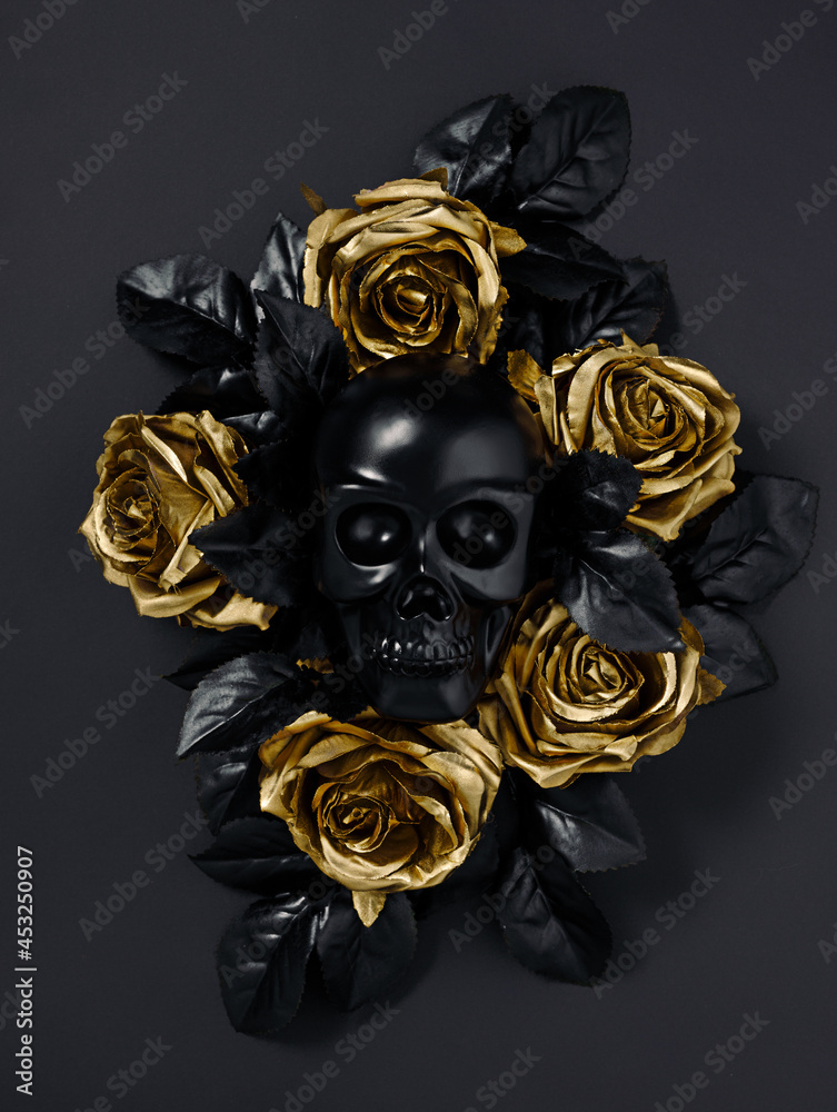 Black skull surrounded with golden rose flowers and black leaves ...
