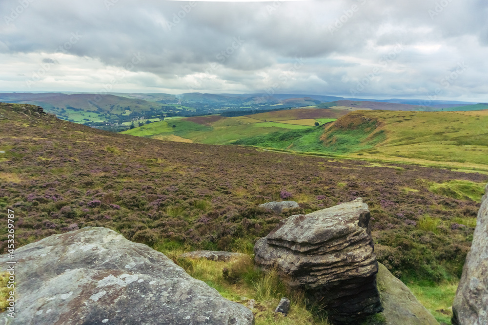 A Photograph of Stanage Edge Rocks and a View of a Far Rural Hill, at ...