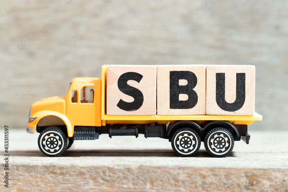 Toy truck hold alphabet letter block in word SBU (Abbreviation of ...