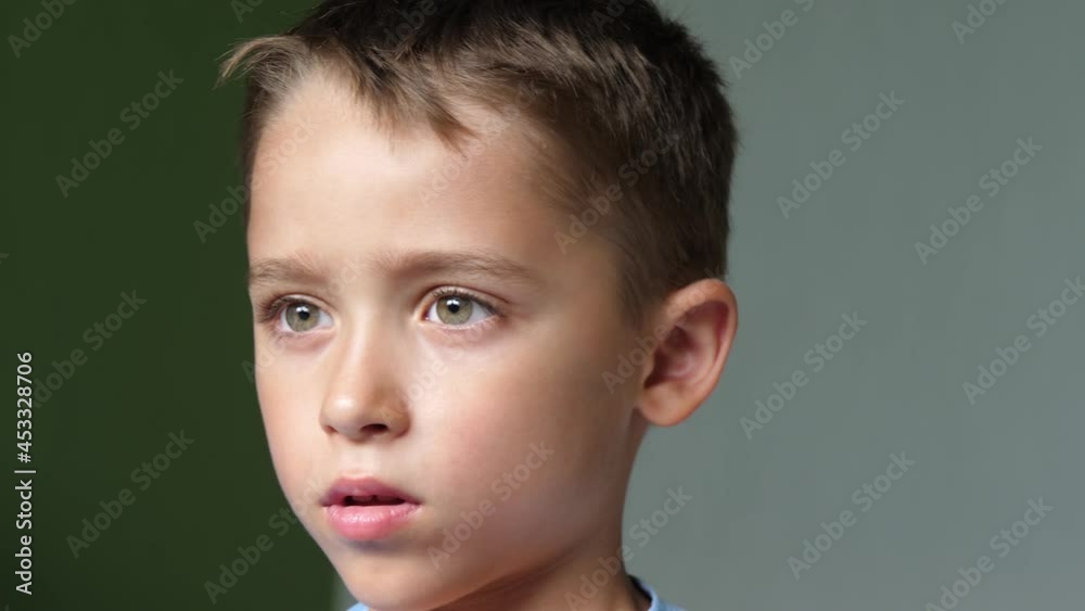portrait of a child enthusiastically looking into the distance ...