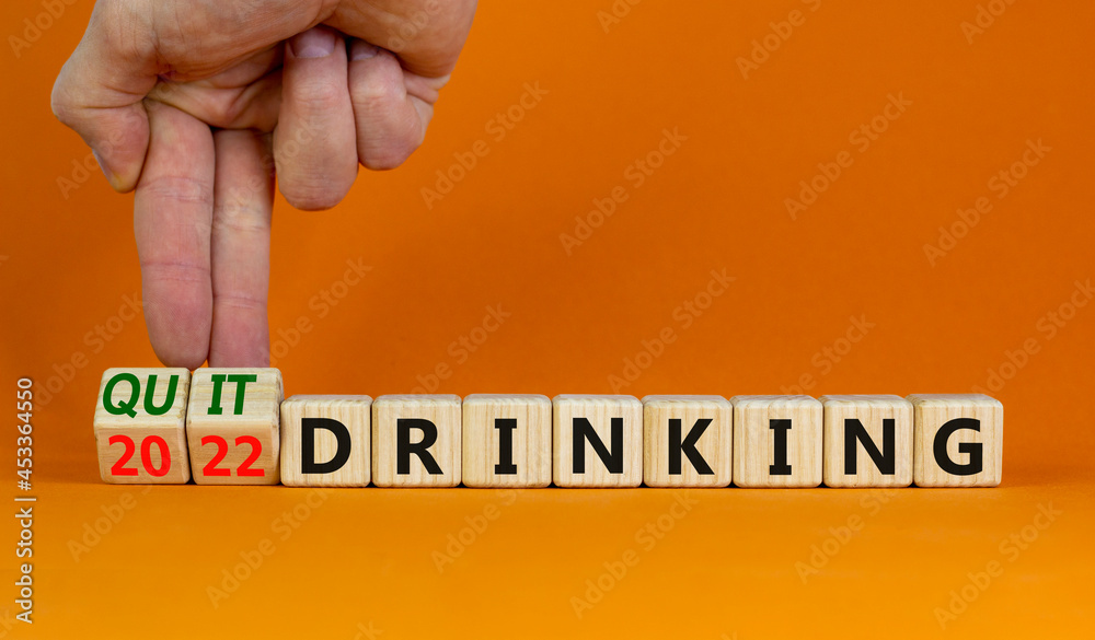 Quit drinking 2022 new years resolution symbol. Businessman turns ...