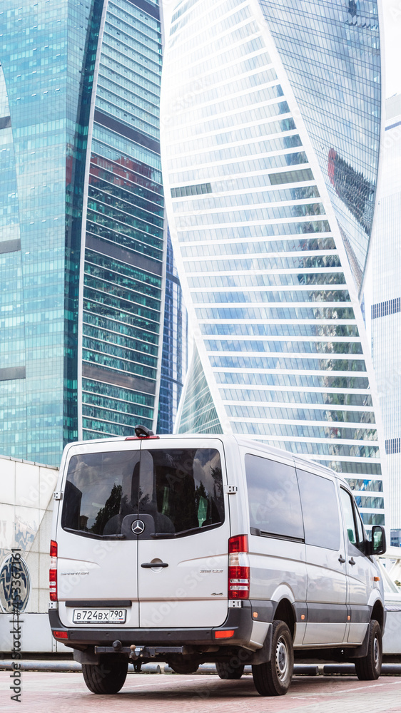 Silver Mercedes-Benz Sprinter 319 CDI passenger van parked in front of ...