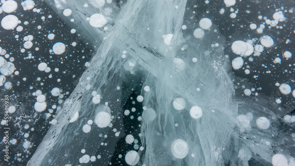 The surface of transparent turquoise ice. Close-up. Full screen ...