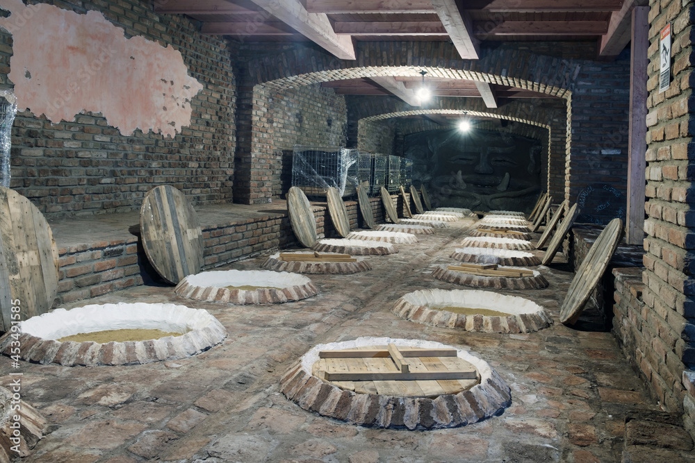 Interior of a traditional Georgian wine cellar marani for processing ...