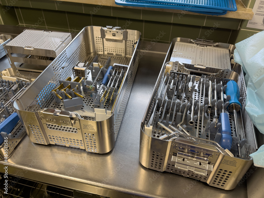 instrument tray contains surgical instruments for implanting a titanium ...