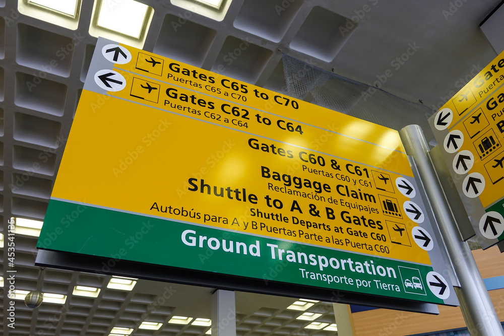 Direction signs at gate of JFK Airport New York Stock Photo | Adobe Stock
