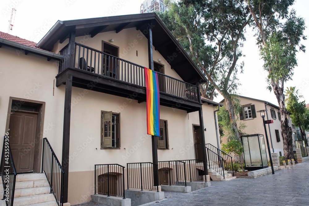 House facade windows decorated with the LGBT rainbow flag, gay pride ...