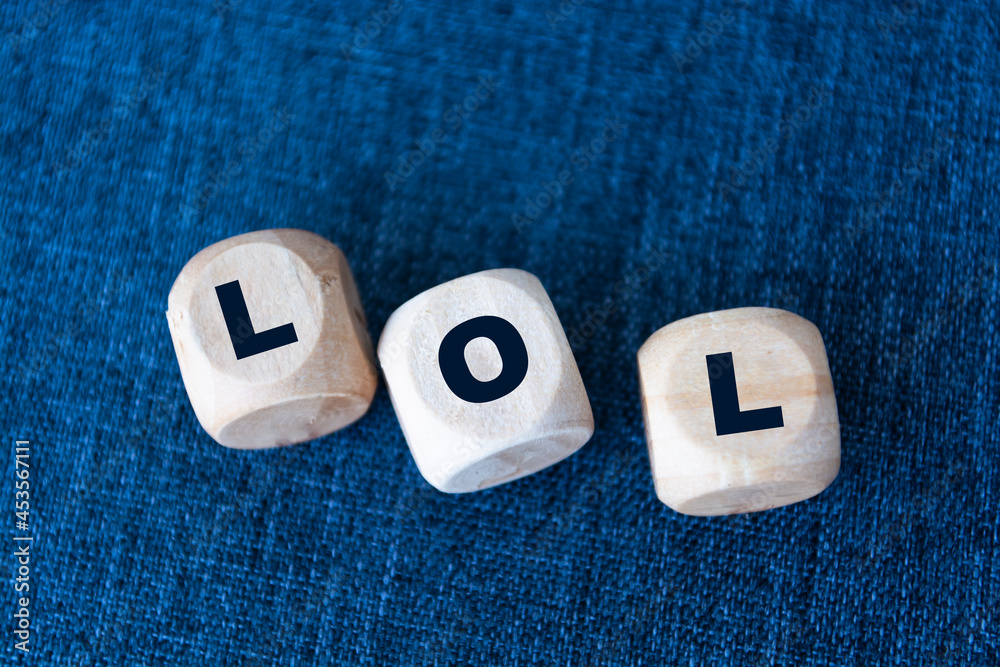 LOL - acronym from wooden blocks with letters, abbreviation LOL laugh ...