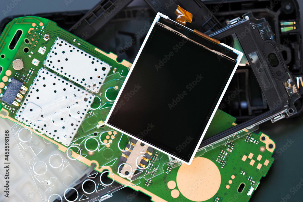 Details of telephone background, top view. Broken mobile phone and ...