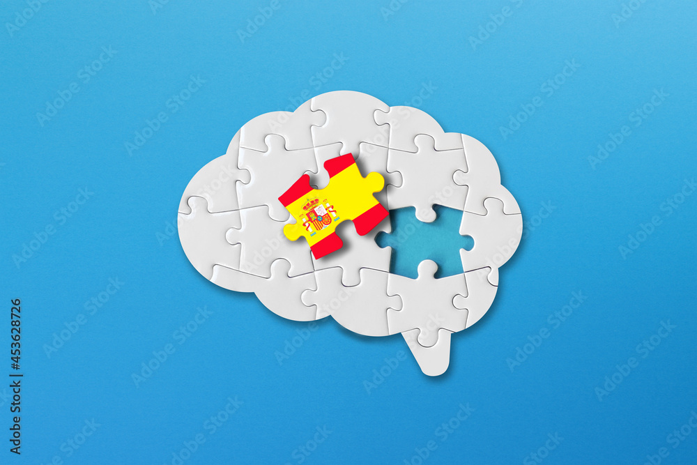 Spanish learning concept, white jigsaw puzzle pieces with spanish flag ...