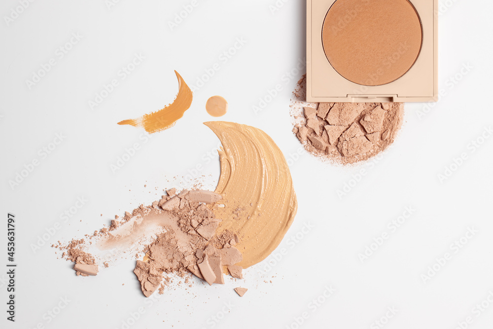 Set of liquid face powder and concealer brush strokes in different ...