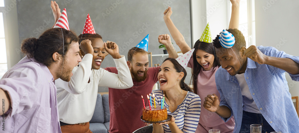Group of cheerful diverse people in their twenties having a fun party ...