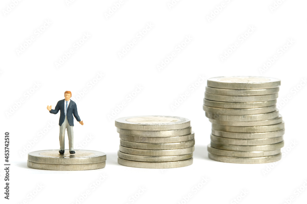 Miniature people toy figure photography. Financial plan concept. A ...