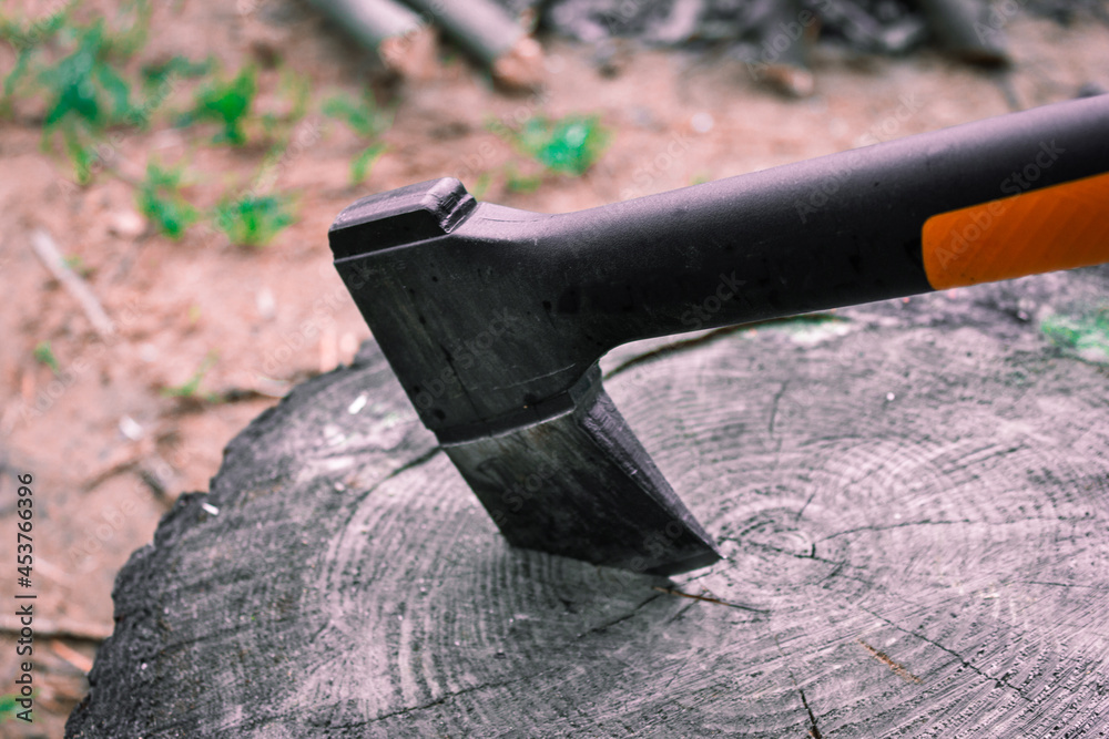 Axe close-up. An axe driven into a log. A sharp axe. A woodcutter's ...