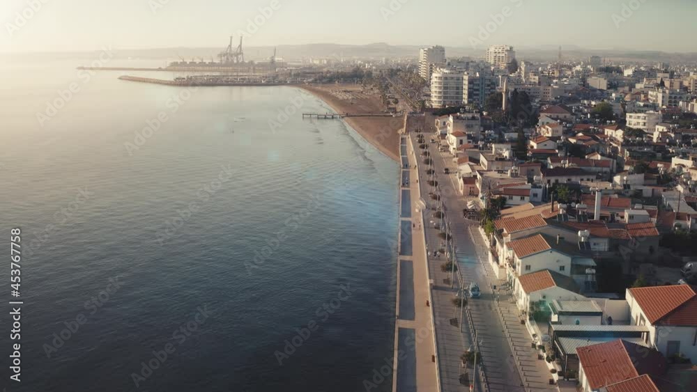 Sunset panorama coastal seaside Larnaca city in Cyprus view. Port and ...