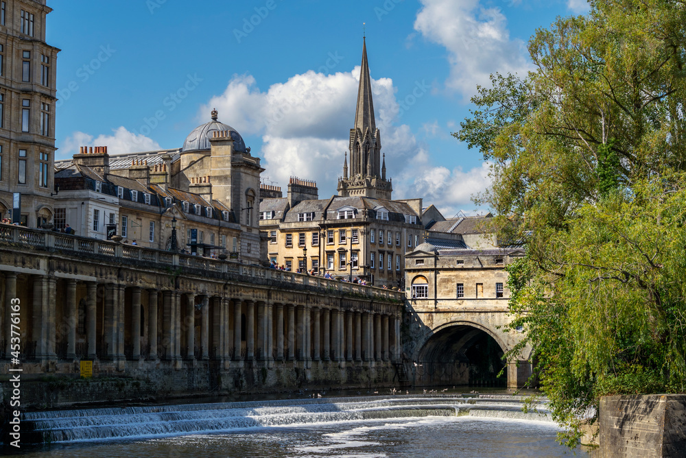 The famous Pulteney Bridge, Bath with shops lining both sides. A ...