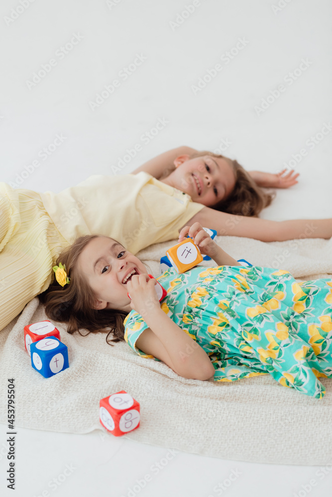 Preschool children learn alphabet using cards, bricks and toys Stock ...