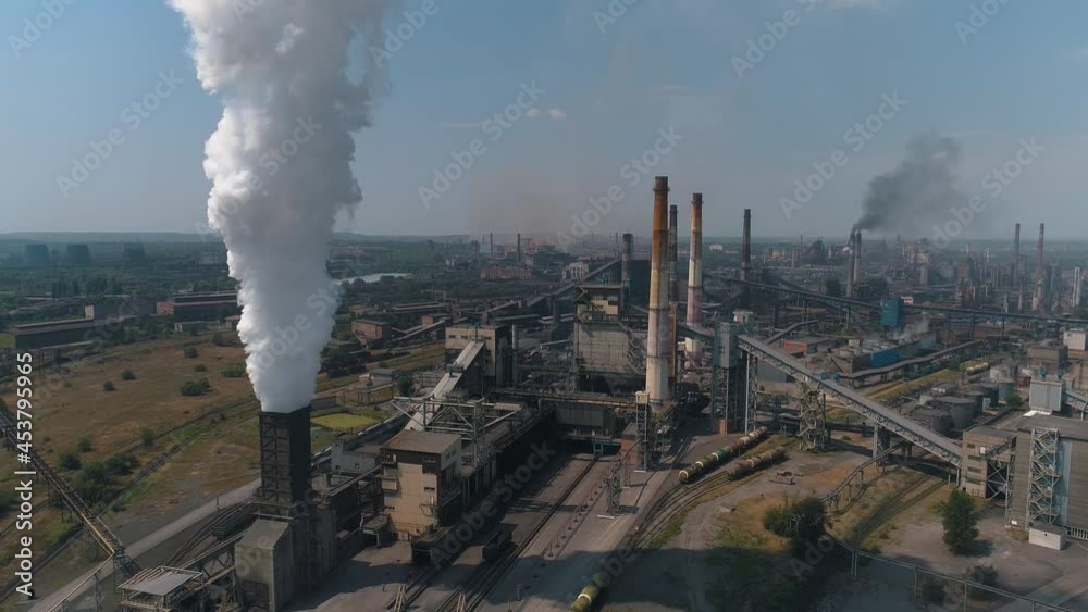 White smoke from a large chimney of a factory. Thick white smoke from ...