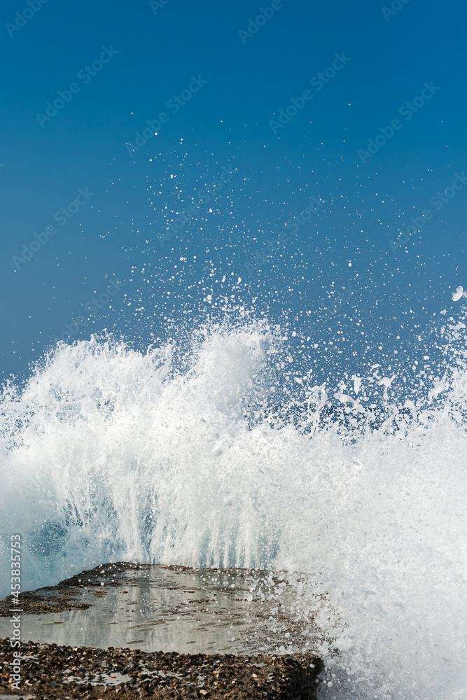 sea wave crashes on a concrete pier, vertical view Stock Photo | Adobe ...