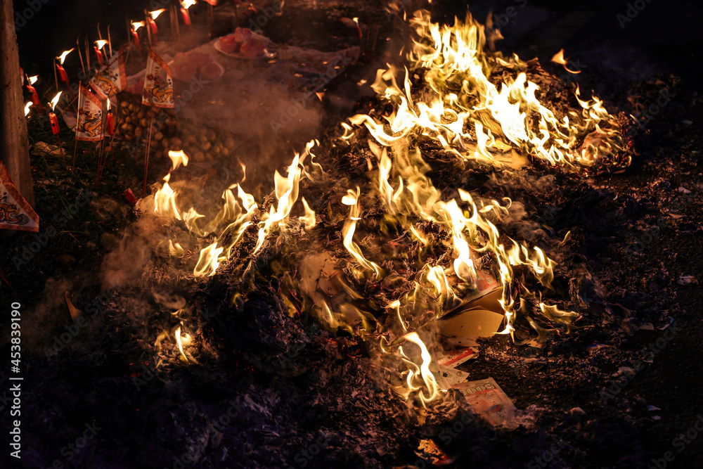 Chinese hungry ghost festival burning flame fire glowing ashes firefly ...