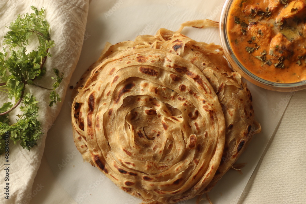 Parotta or Porotta, a layered flatbread made of Maida. This flaky ...