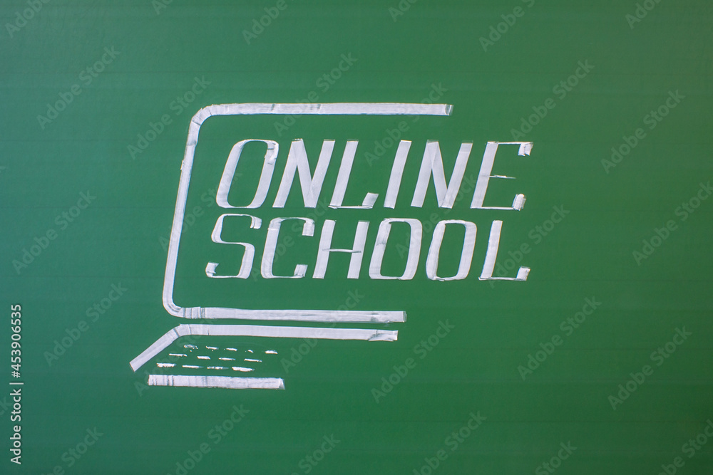 The inscription on the green blackboard in white chalk in man-made font ...