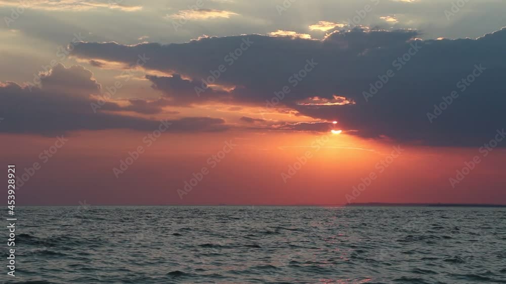 Dramatic evening red sky with the sun rays crossing the clouds. Harmony ...