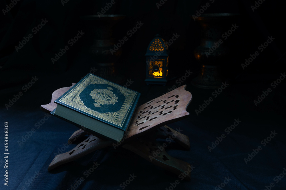 Quran in the mosque - open for prayers The black background of the ...