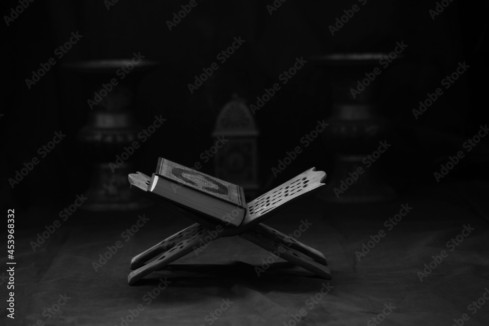 Quran in the mosque - open for prayers The black background of the ...