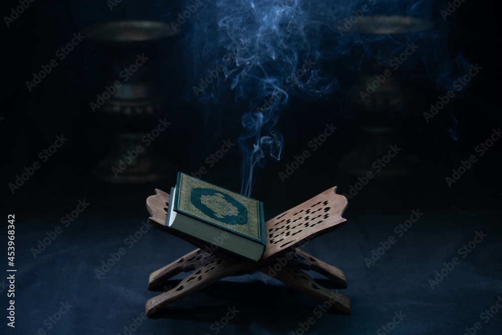 Quran in the mosque - open for prayers The black background of the ...
