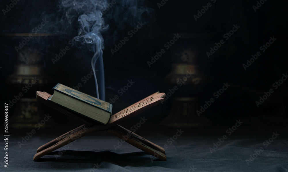 Quran in the mosque - open for prayers The black background of the ...