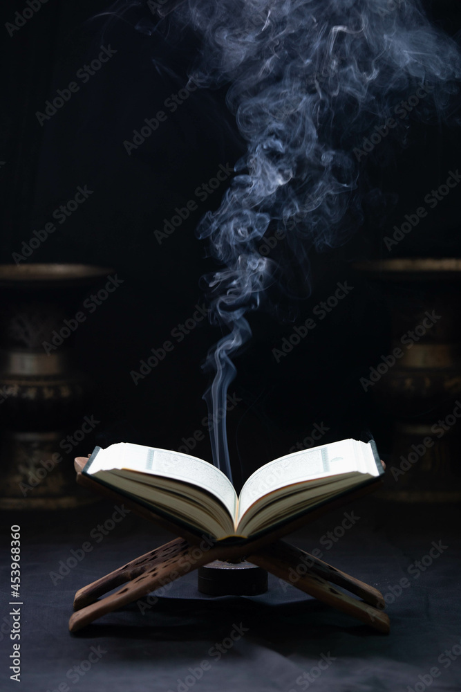 Quran in the mosque - open for prayers The black background of the ...