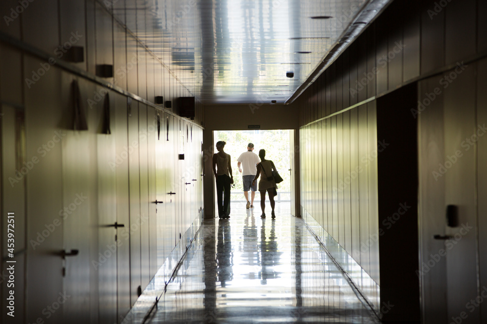 People walking in corridor inside modern building Stock Photo | Adobe Stock