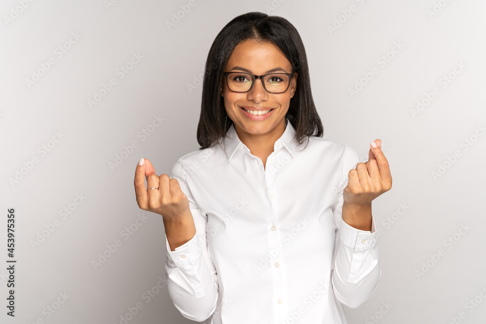 Successful businesswoman of mix race smile doing money gesture with ...