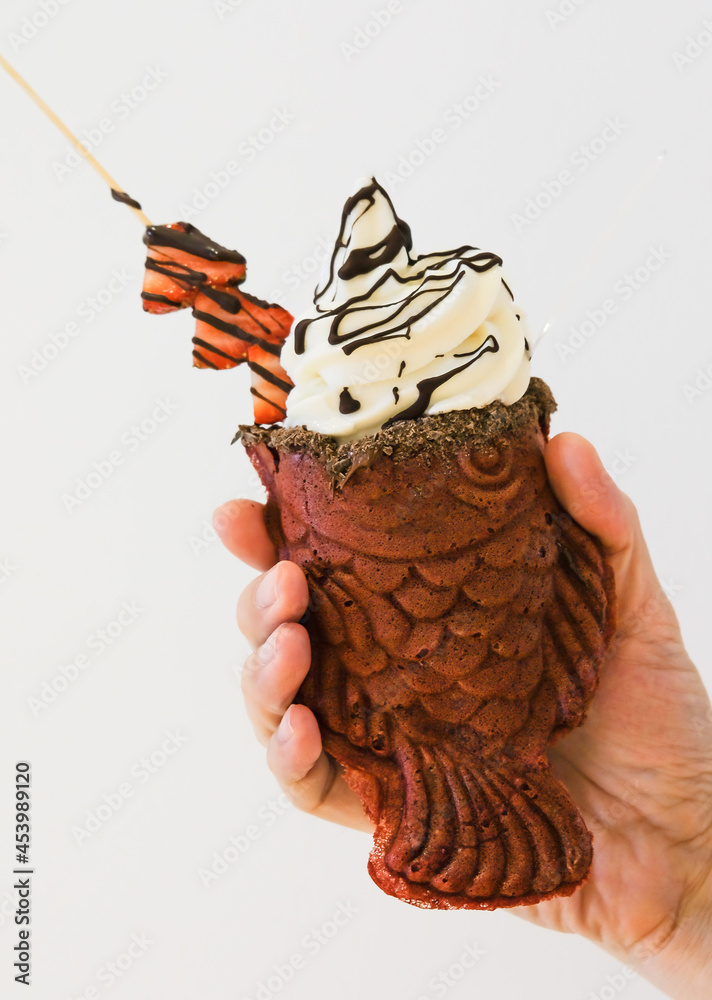 Japanese sweet dessert. Ice Cream Taiyaki. Freshly baked fish shape ...