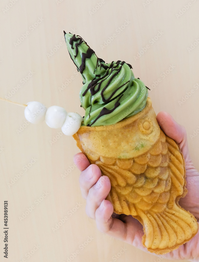 Japanese sweet dessert. Ice Cream Taiyaki. Freshly baked fish shape ...