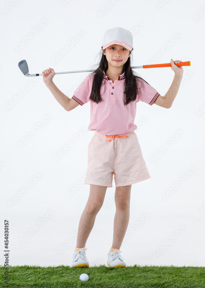 Studio shot of pretty cute long hair little Asian golfer in sport ...