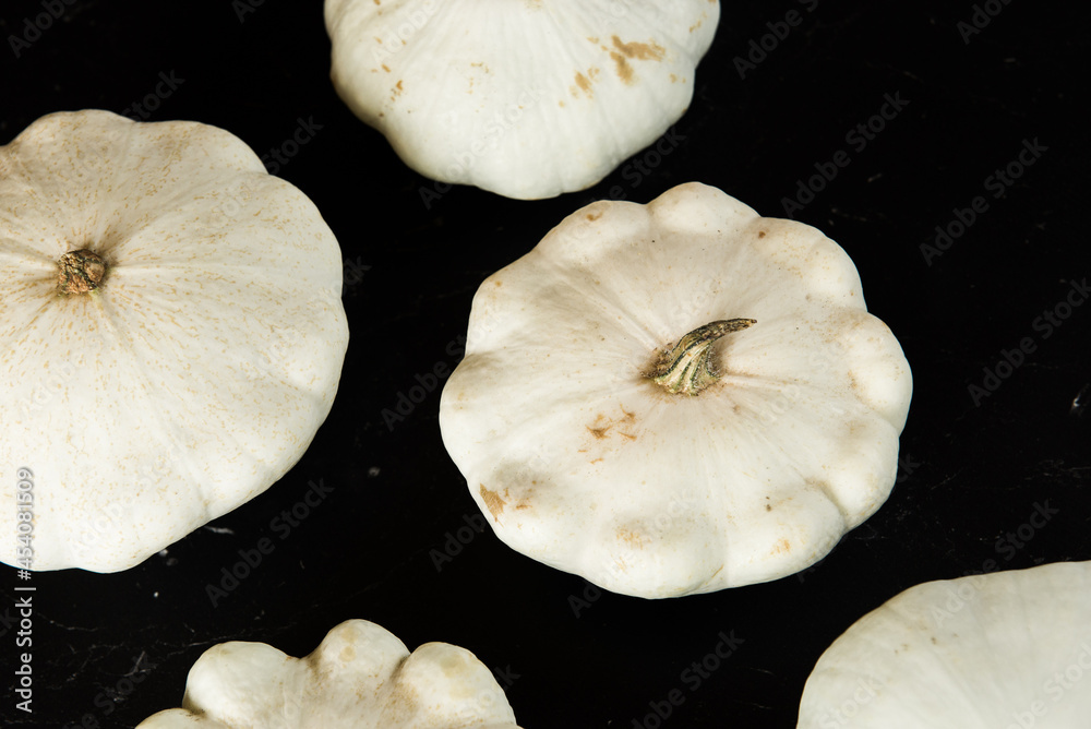 patison pumpkin squashed on dark kitchen table, whole bio raw vegetable ...