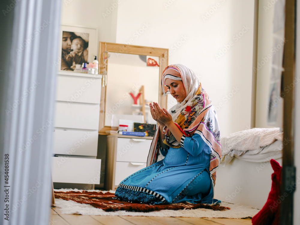 Muslim Woman Praying At Home