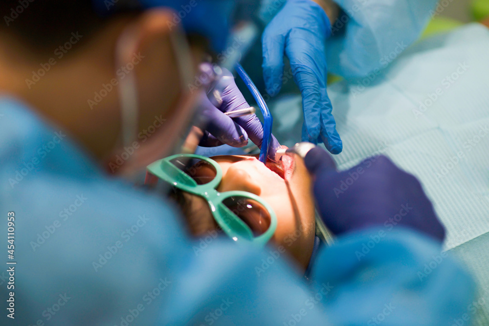 Asian child having dentist dental appointment.School kid getting teeth ...