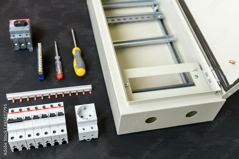 Editorial use only; Assembling the electrical panel: ABB circuit ...