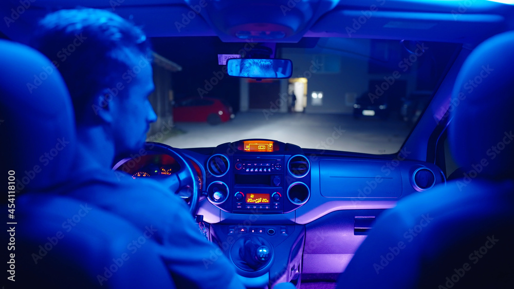 Neon lights glow inside the car while driving at night Stock Photo ...