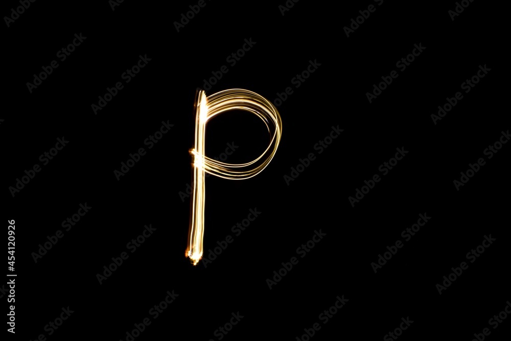 Drawn letter P with gold lights against black background. Light ...