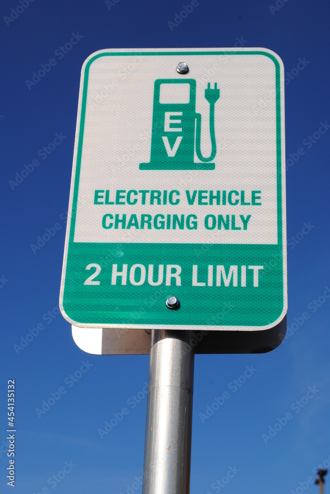 Electronic Vehicle charging station sign. EV charging only 2 hour limit ...