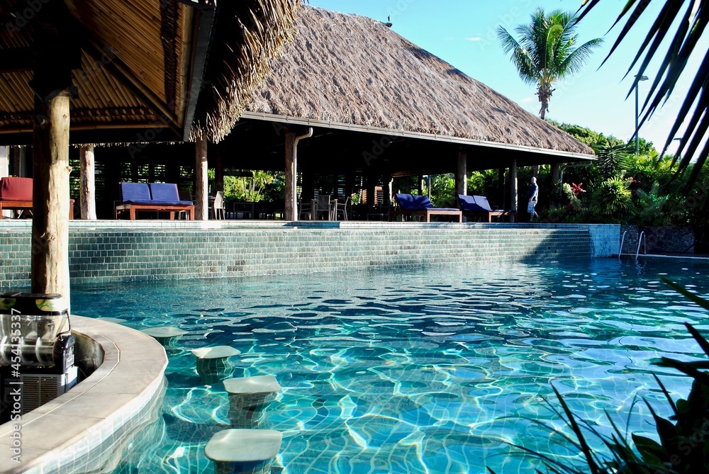 Sigatoka, Fiji: A swim-up pool bar in a turquoise swimming pool ...