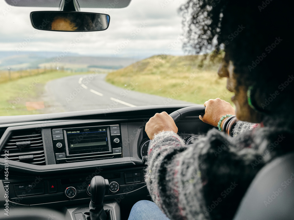 Woman driving car Stock Photo | Adobe Stock