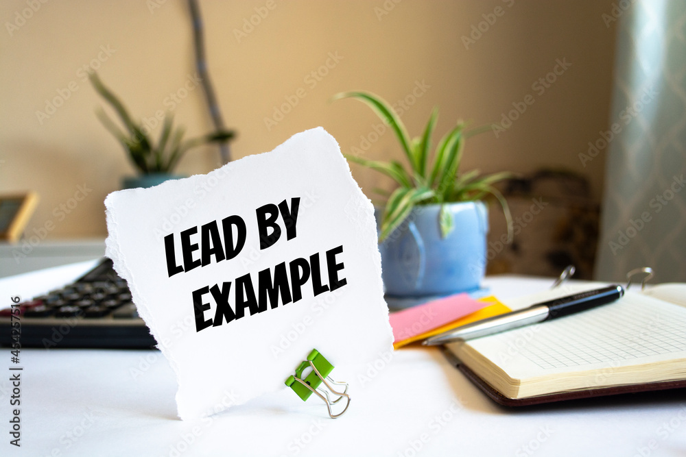 Text lead by example on the short note texture background Stock Photo ...