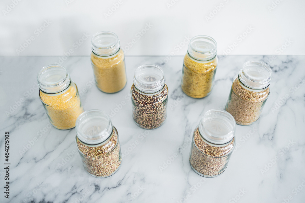 clear pantry jars with different types of grains in them including ...