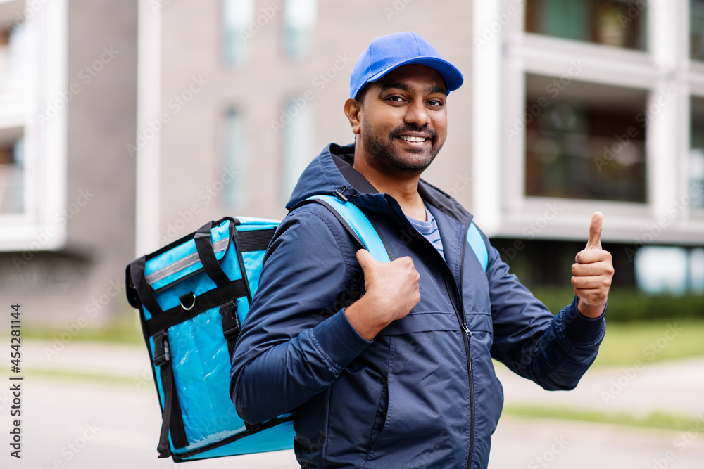 food shipping, profession and people concept - happy smiling indian ...