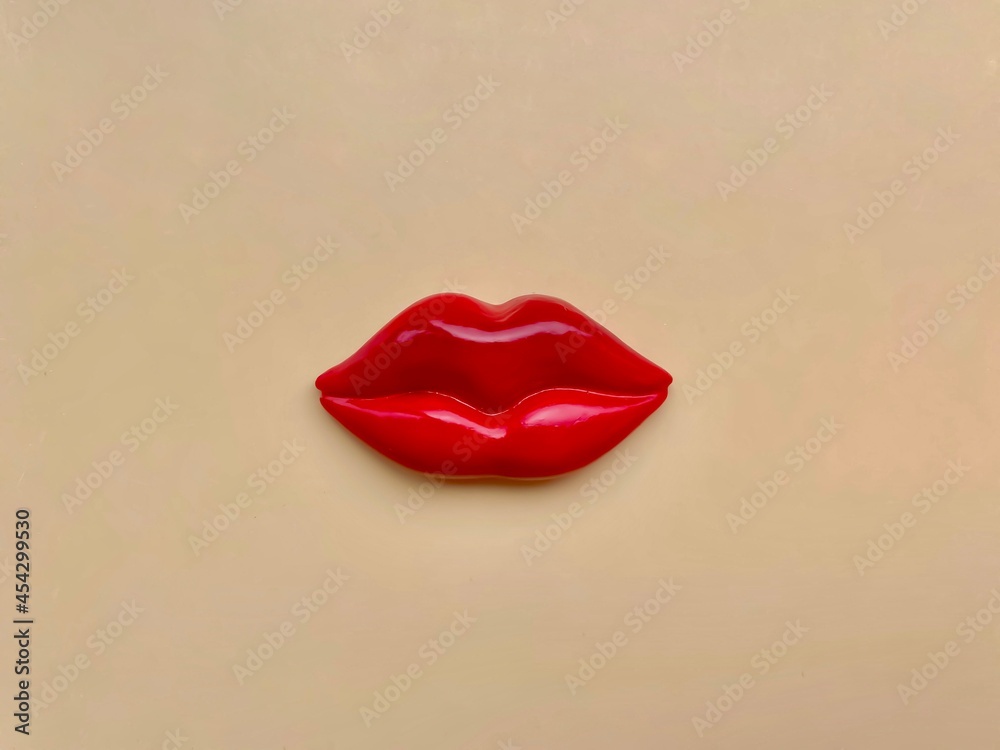 Female red lips isolated on light skin color background. Plastic lips ...